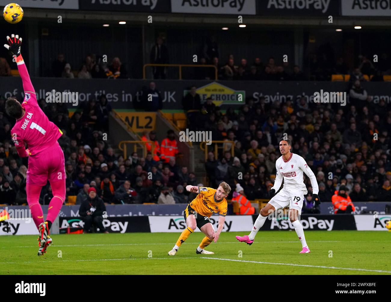 Manchester United's Raphael Varane (right) attempts a shot on goal ...