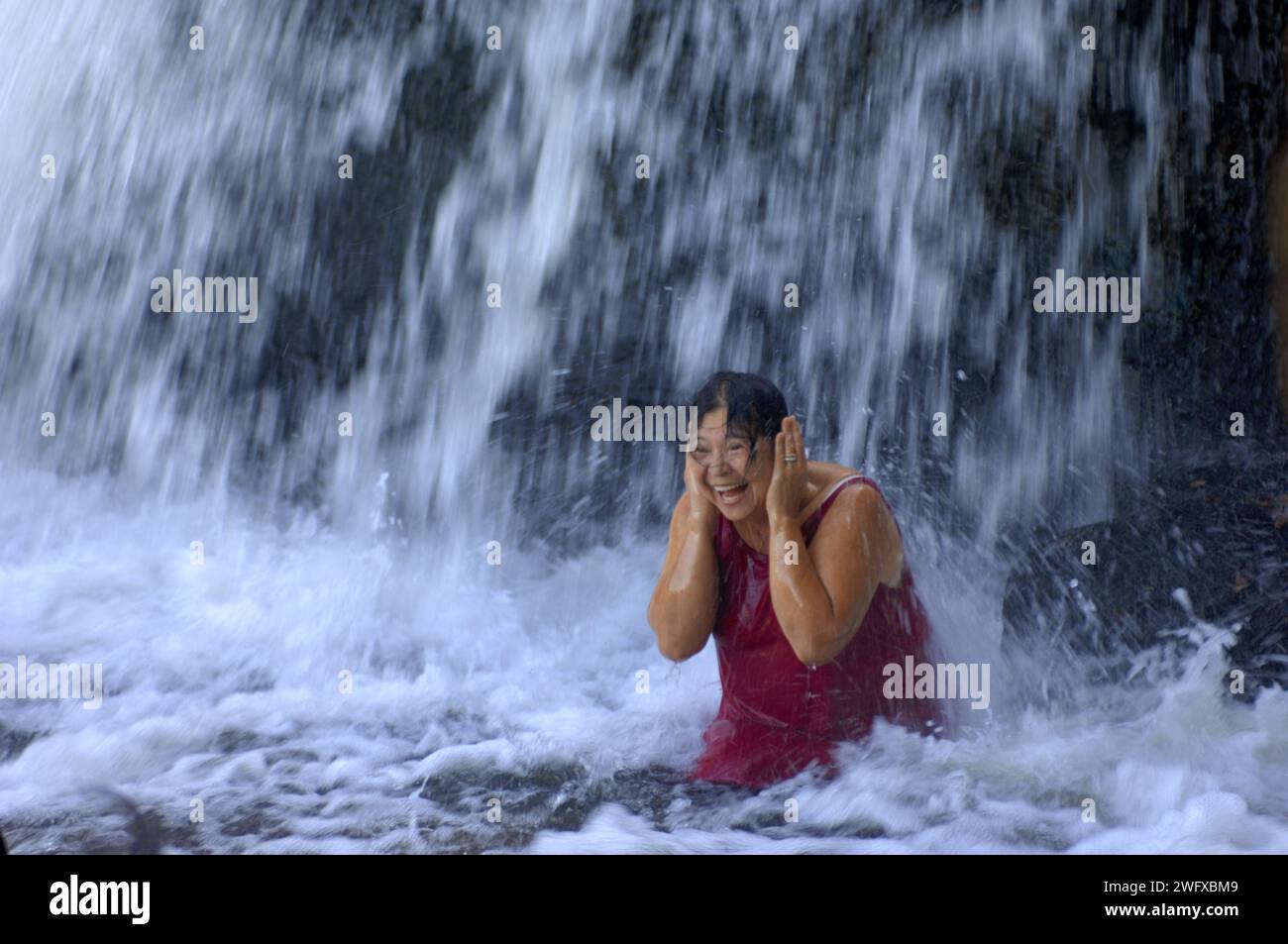 Cambodian woman bathing at Phnom Kulen Waterfall, Phnom Kulen National ...