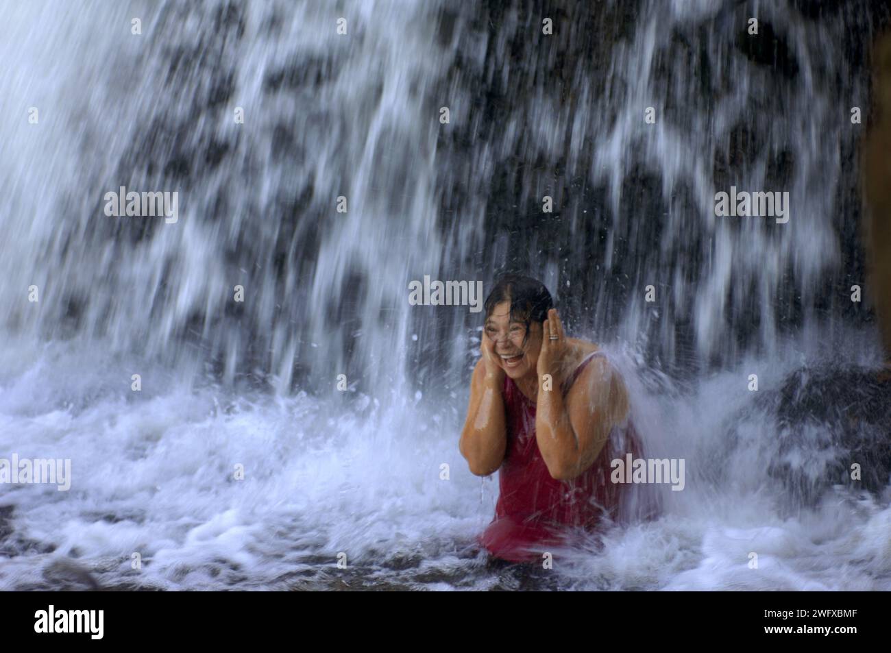 Cambodian woman bathing at Phnom Kulen Waterfall, Phnom Kulen National ...