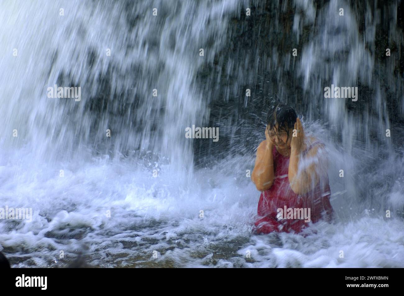 Cambodian woman bathing at Phnom Kulen Waterfall, Phnom Kulen National ...