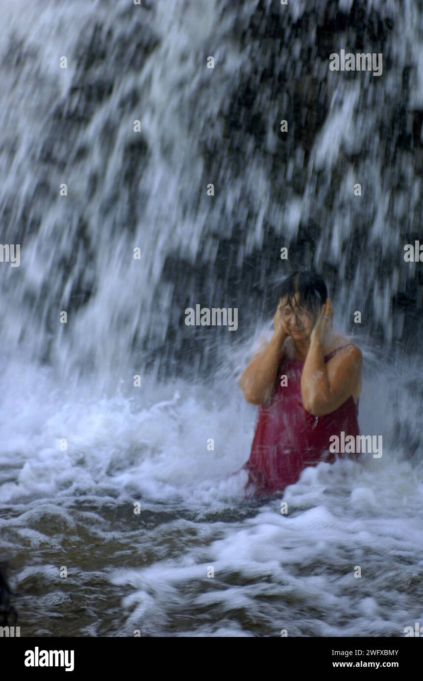 Cambodian woman bathing at Phnom Kulen Waterfall, Phnom Kulen National ...