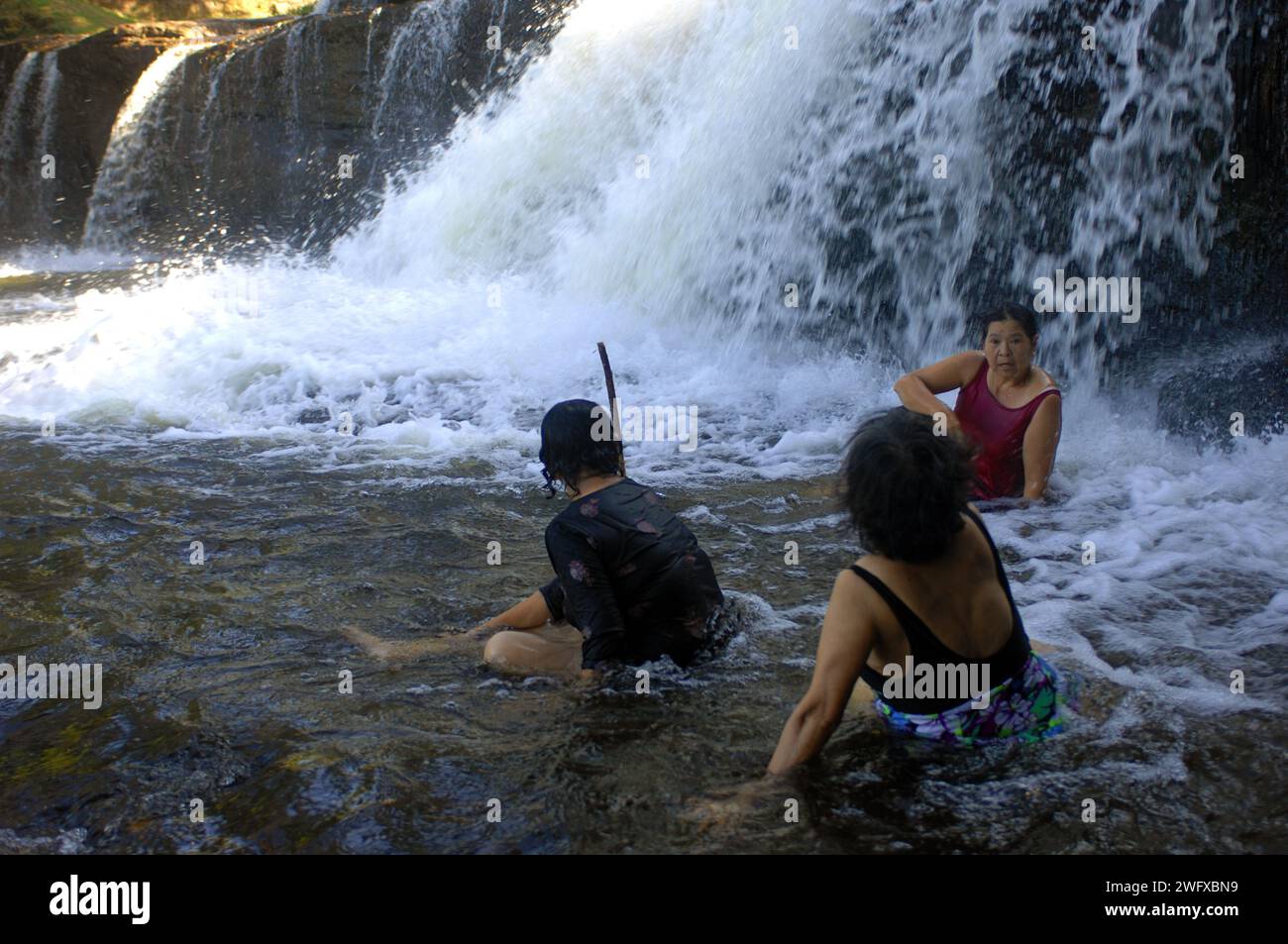 Three Local Cambodian Women Bathing In The Phnom Kulen Waterfall Phnom