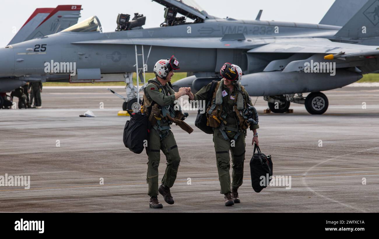 U.S. Marine Corps Maj. James Campbell, left, a pilot, and Maj. Patrick ...