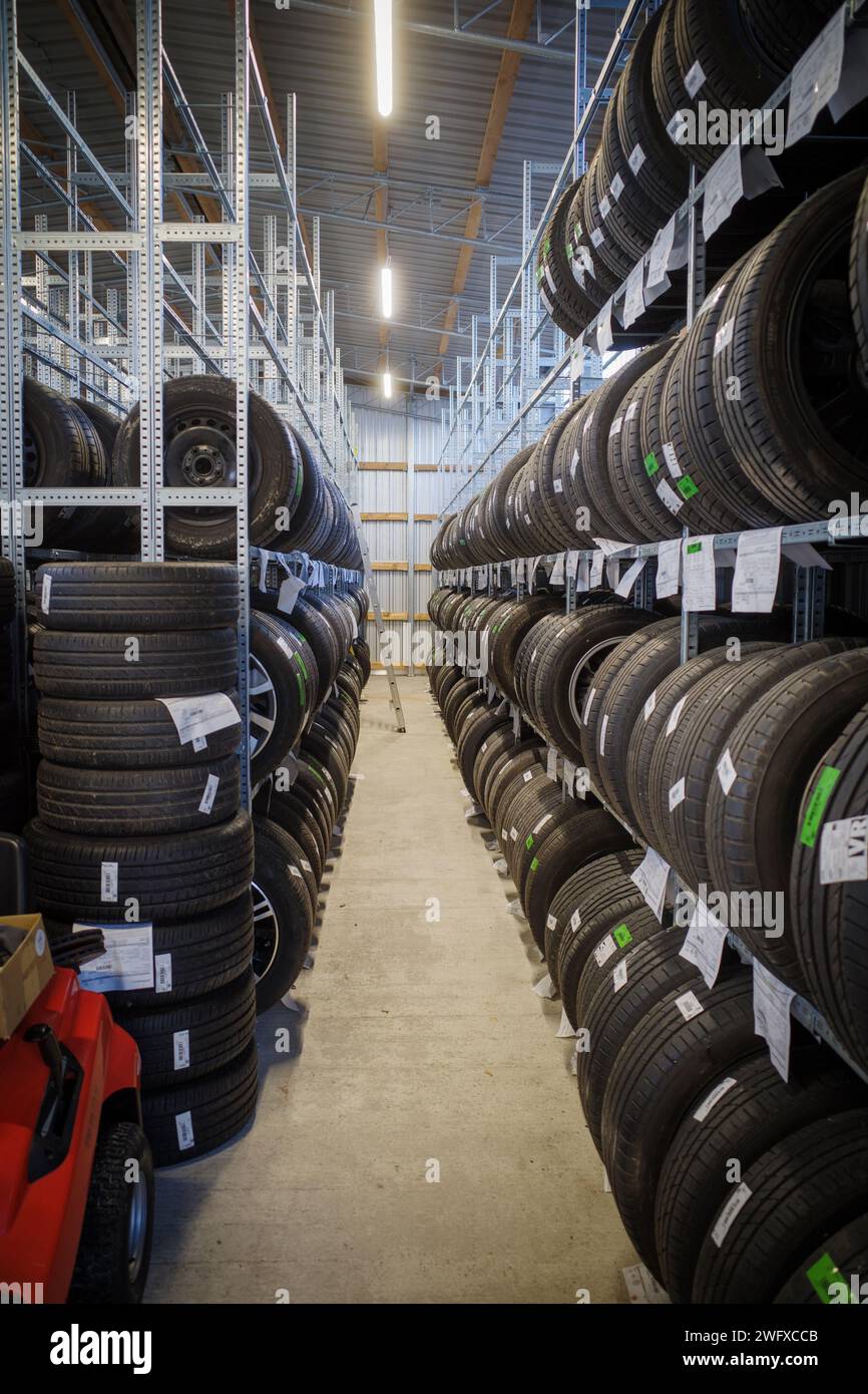 many wheels are stored in the tire warehouse of a car repair shop Stock ...