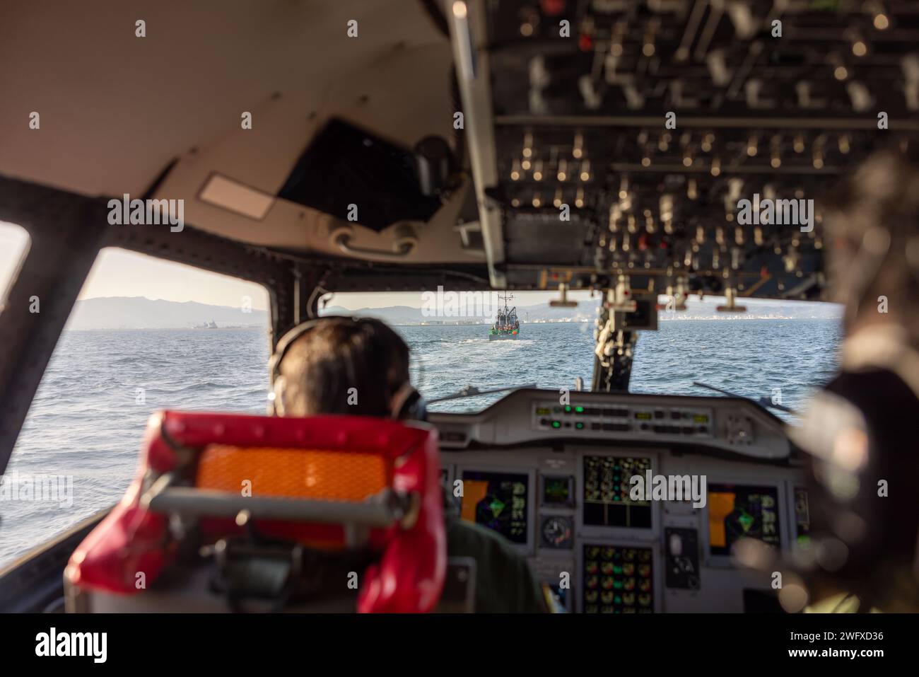 A Japan Maritime Self-Defense Force ShinMaywa US-2 pilot follows a ...