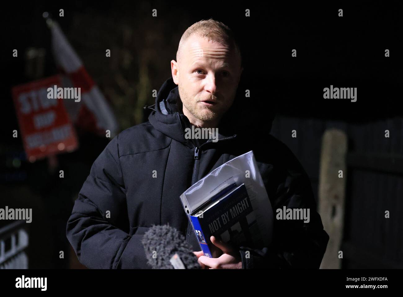 Jamie Bryson speaking to the media before a public meeting at Moygashel ...