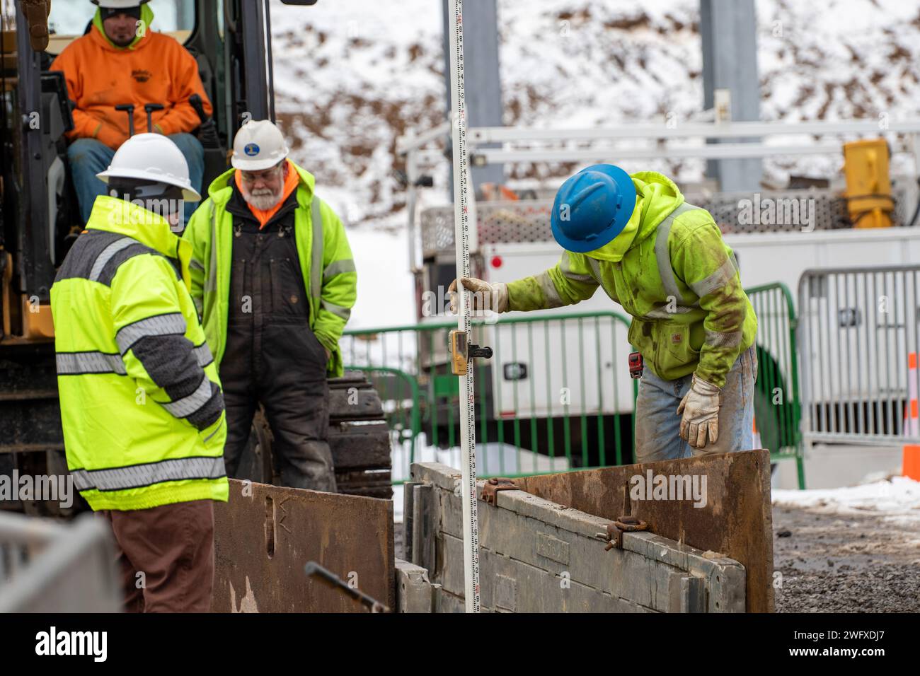 A construction crew working for the U.S. Army Corps of Engineers ...