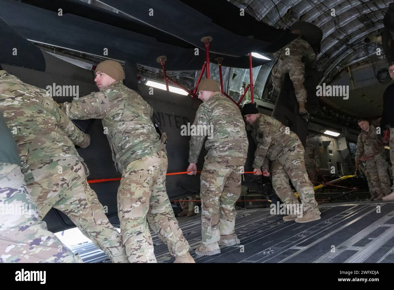 Members of 1st Battalion, 126th Aviation Regiment retrograde nine UH-60 ...