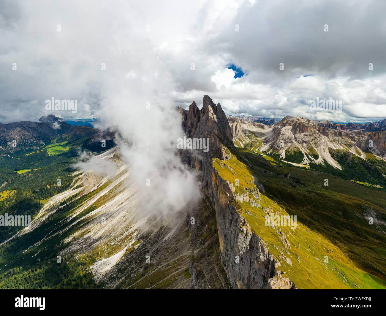 Dense fog surrounds giant seceda hi-res stock photography and images ...