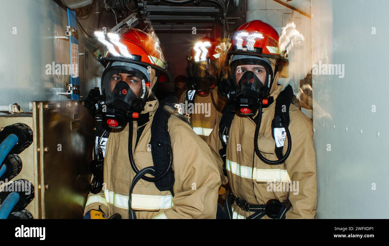 Sailors prepare to fight a simulated fire onboard Nimitz-class aircraft ...