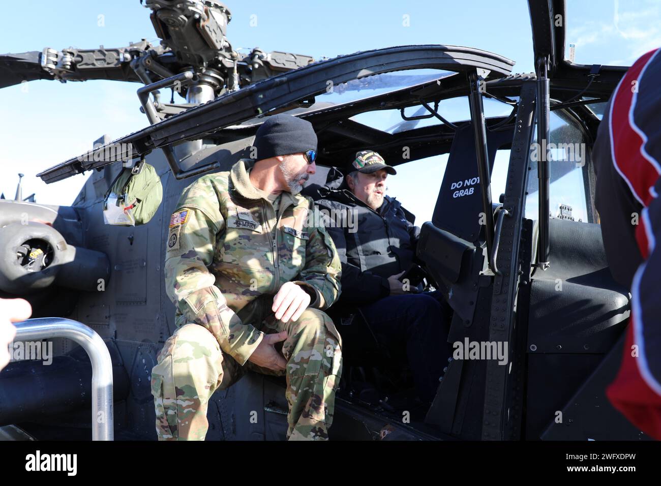 Civic leaders from the city of Rehobeth take turns sitting in an AH-64 ...