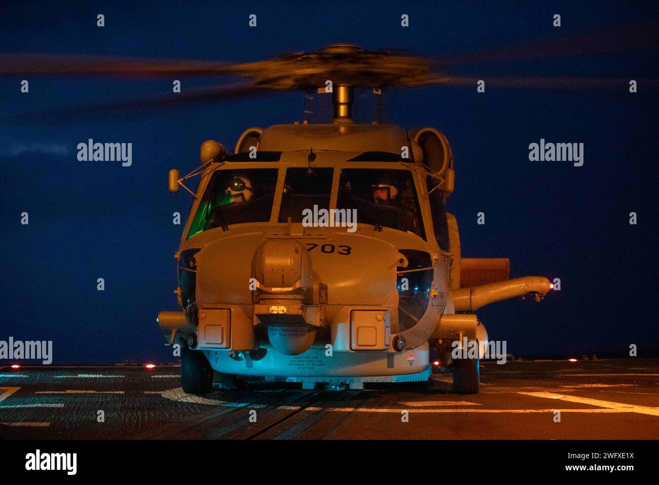 240103-N-CD319-1019 SOUTH CHINA SEA (Jan. 3, 2024) An MH-60R Sea Hawk ...