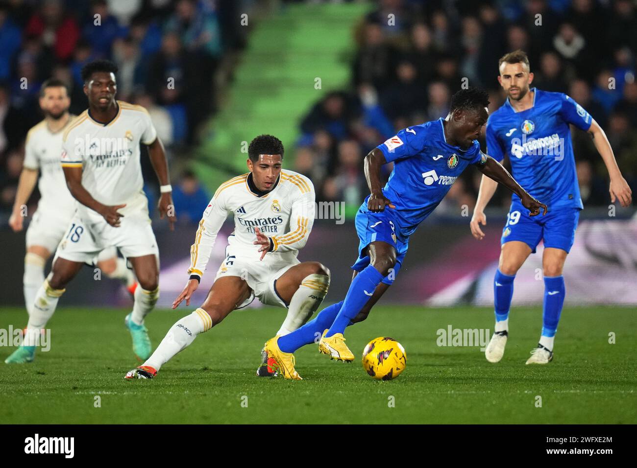 Djene Dakonam of Getafe CF and Jude Bellingham of Real Madrid during ...