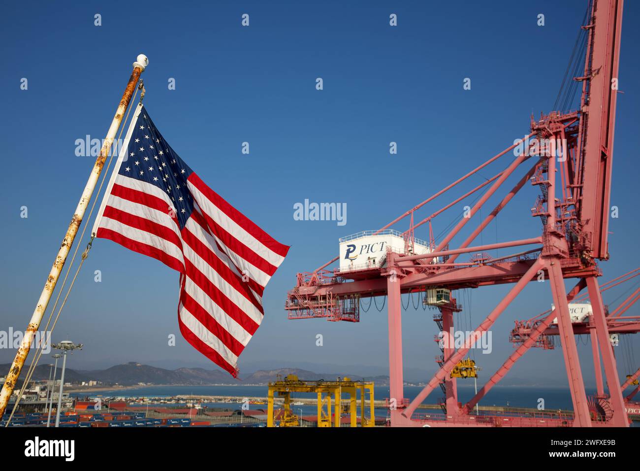 A U.S. flag on the stern of the MV Green Lake proudly waves in the wind ...
