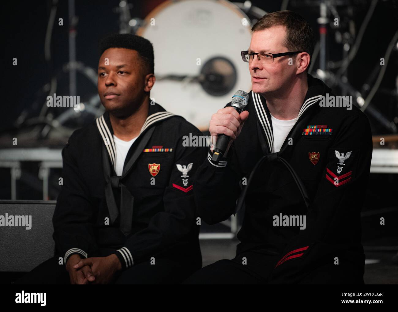 U.S. Naval Forces Europe-Africa (NAVEUR-NAVAF) band members speak to ...