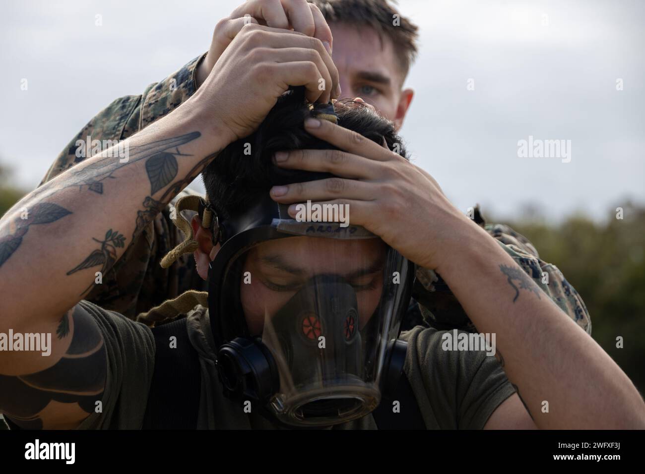 U.S. Marine Corps Cpl. Cesar I. Arroyo, front, and Lance Cpl. Zachary T ...