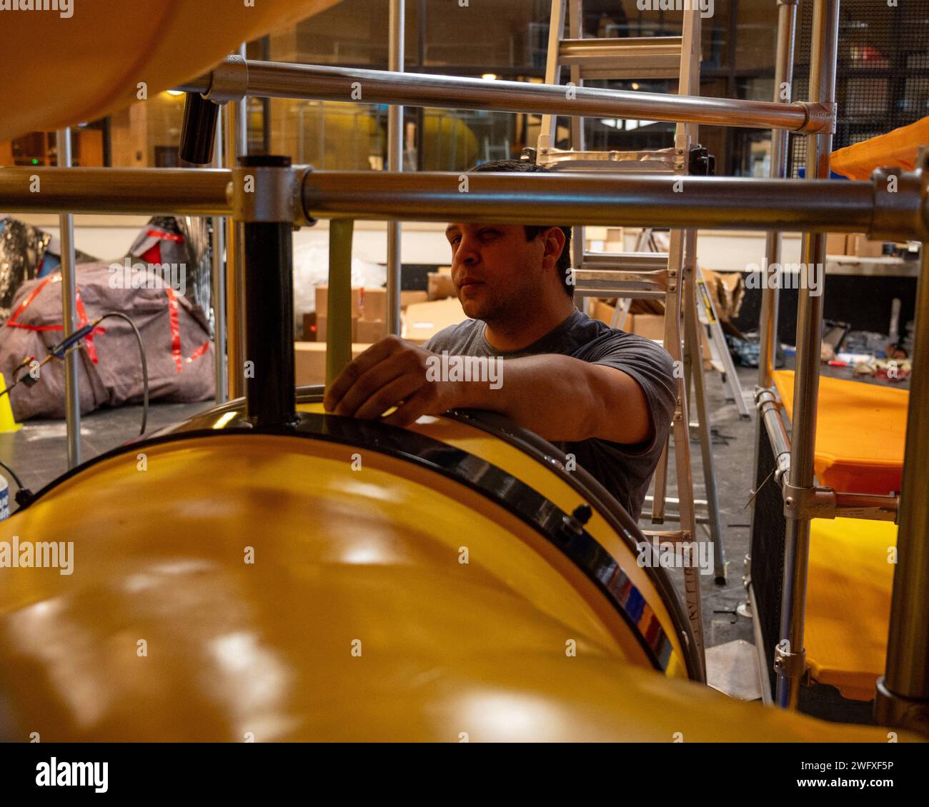 Travis Defusco, playground installation contractor, measures the gap ...