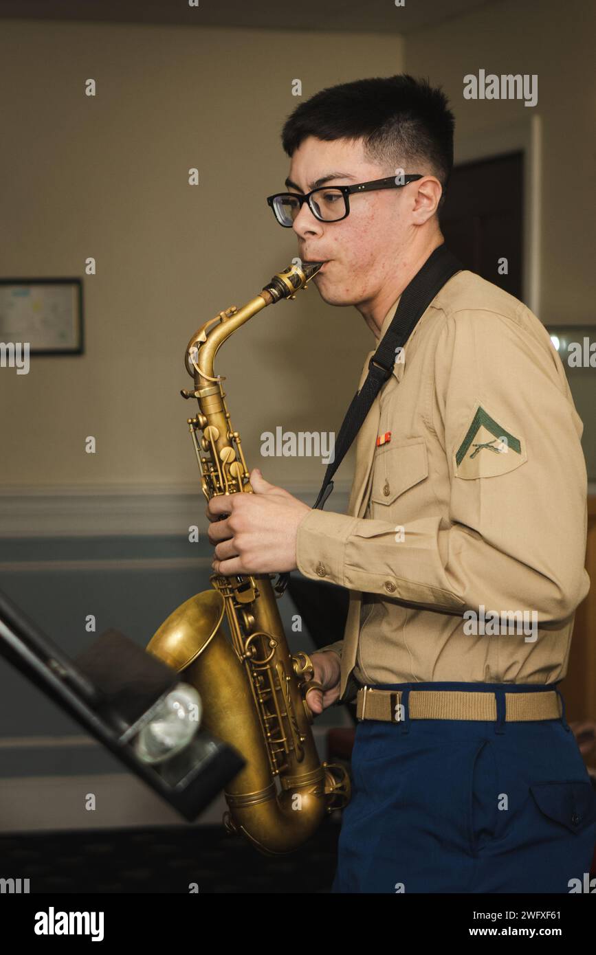 U.S. Marine Corps Lance Cpl. Christopher Delgado, an alto saxophonist ...