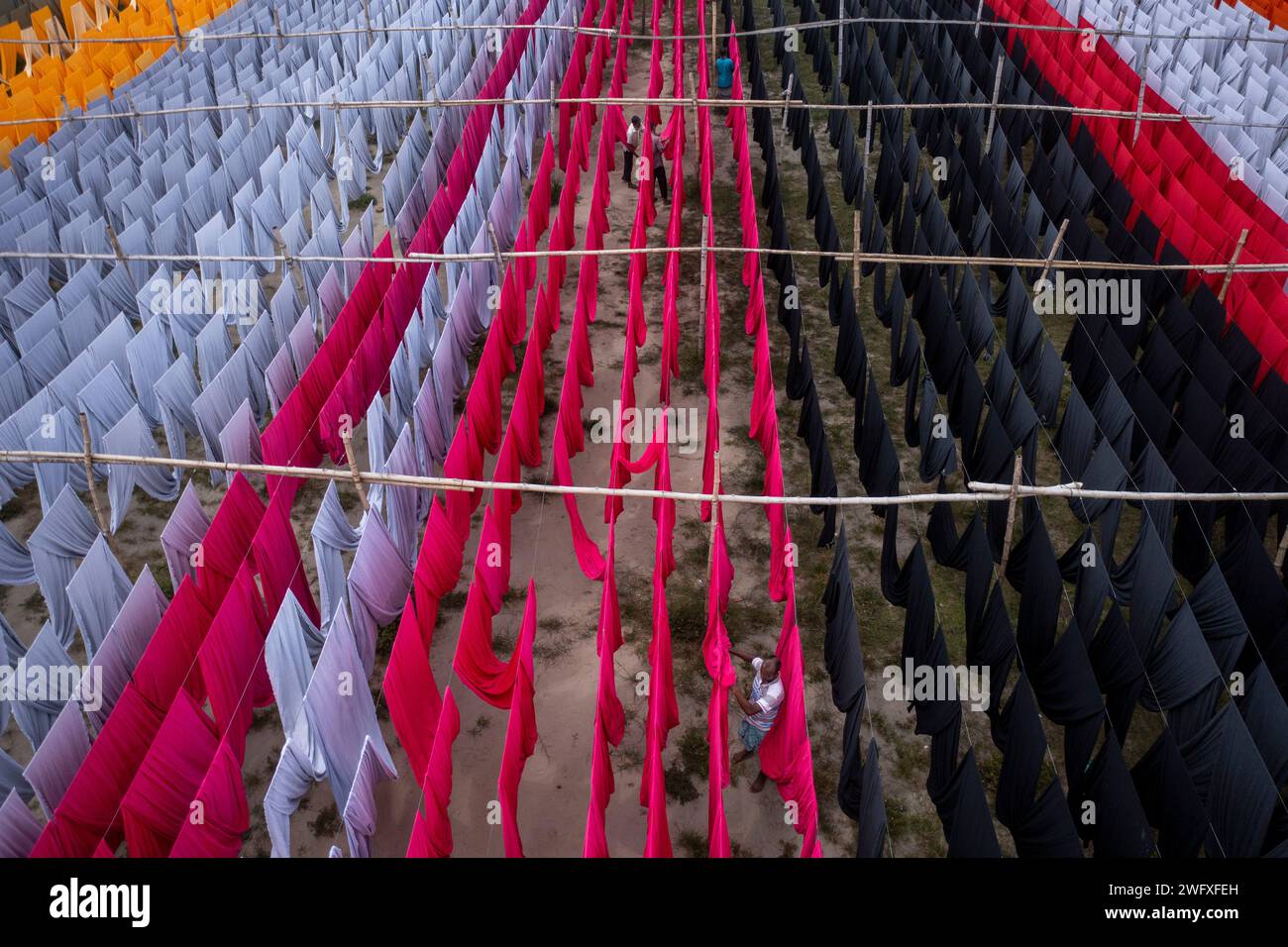 Aerial view of people working in a public laundry hanging for drying ...