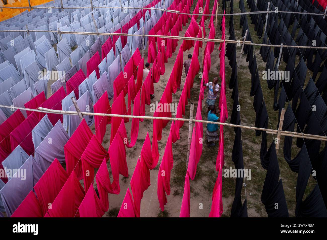 Aerial view of people working in a public laundry hanging for drying ...