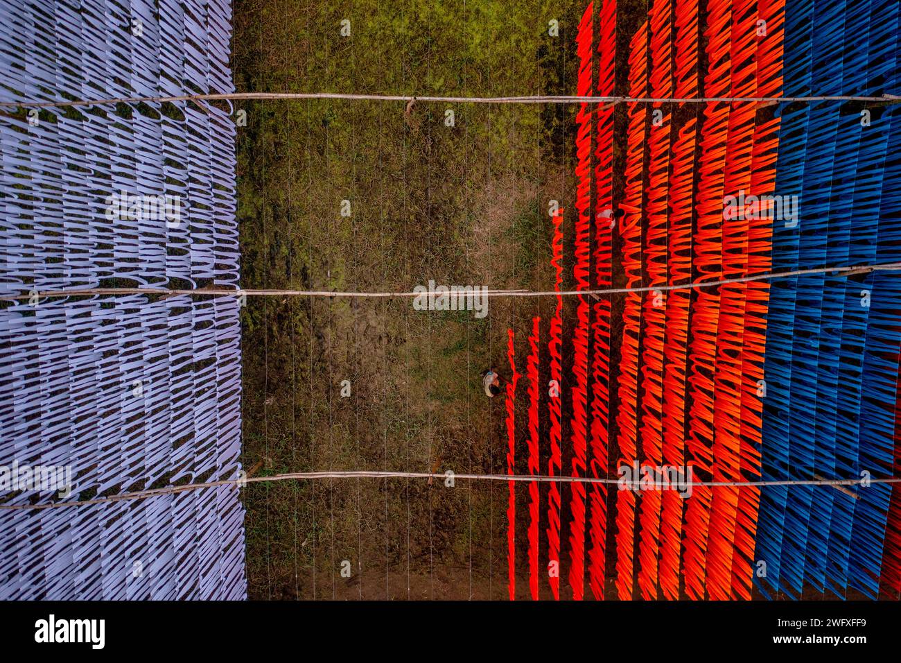 Aerial view of people working in a public laundry hanging for drying ...