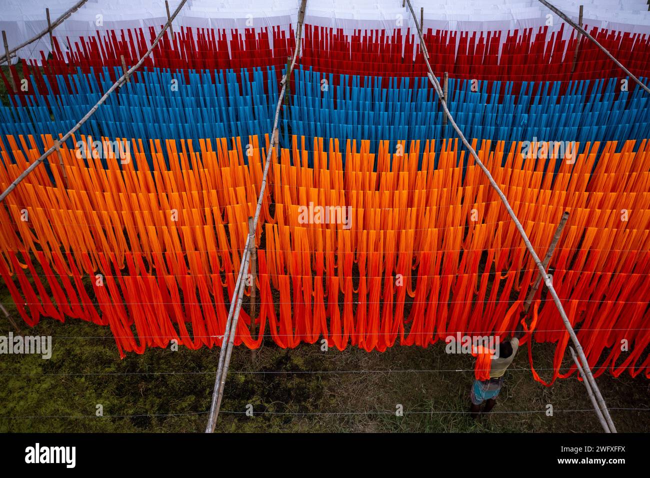 Aerial view of people working in a public laundry hanging for drying ...