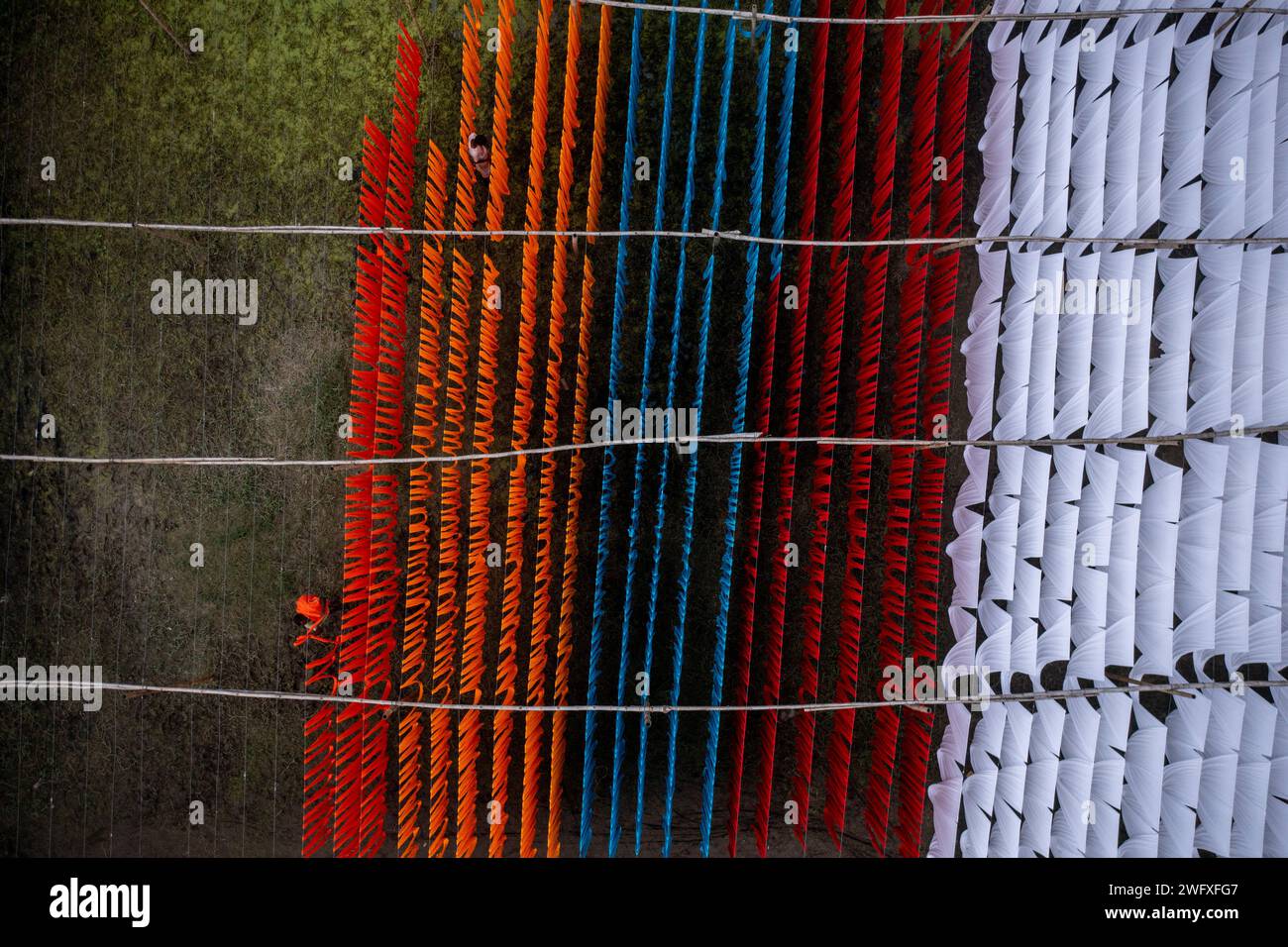 Aerial view of people working in a public laundry hanging for drying ...