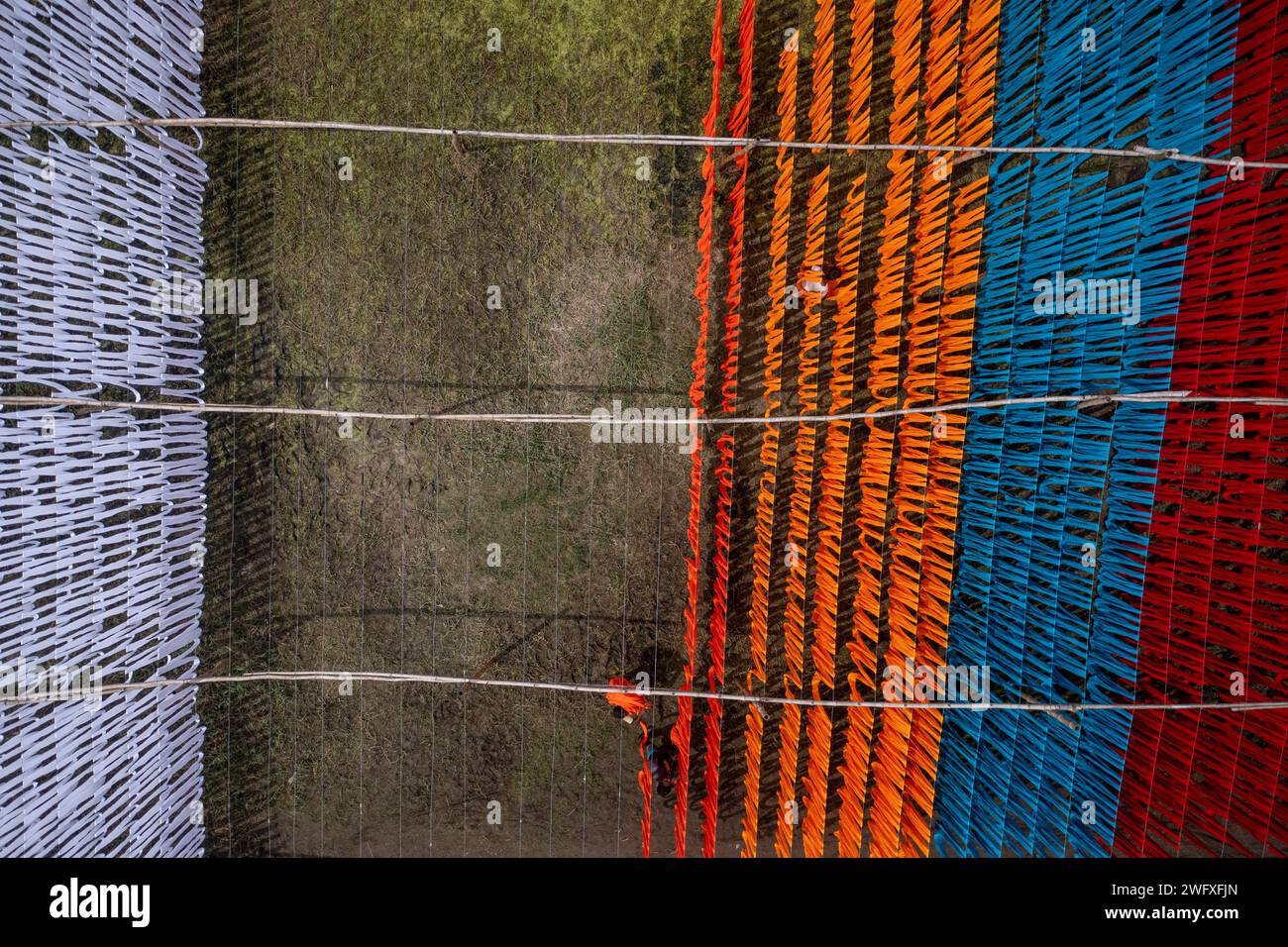 Aerial view of people working in a public laundry hanging for drying ...
