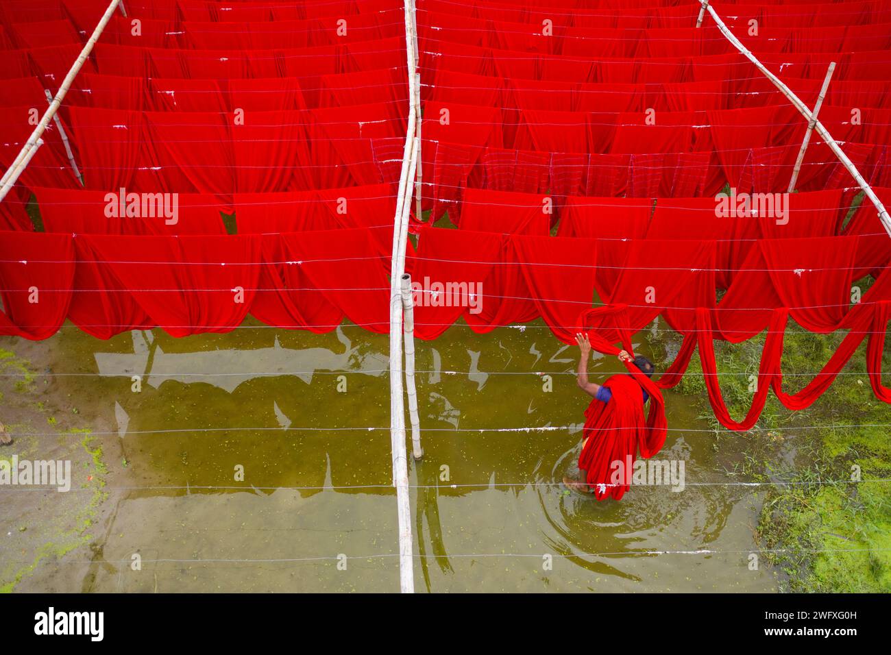 Aerial view of people working in a public laundry hanging for drying ...