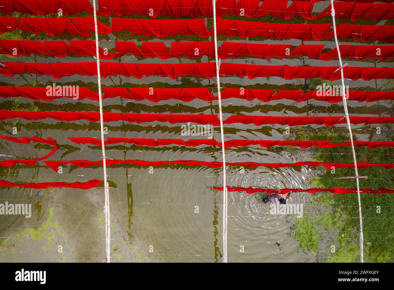 Aerial view of people working in a public laundry hanging for drying ...
