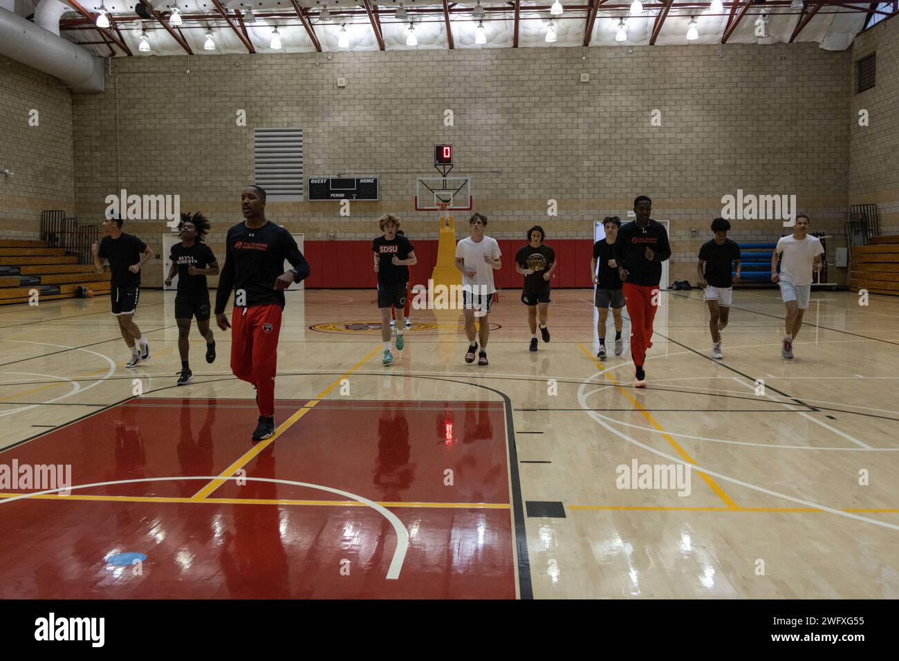 U.S. Marines with the All-Marine Men’s Basketball Team lead a ...