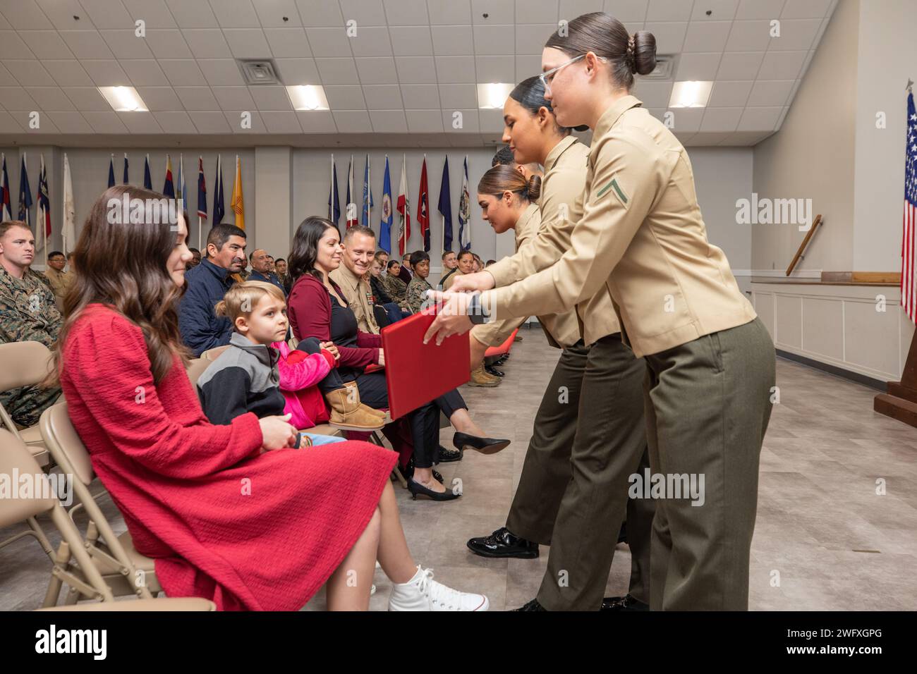 U.S. Marines with Marine Corps Combat Service Support Schools hand ...
