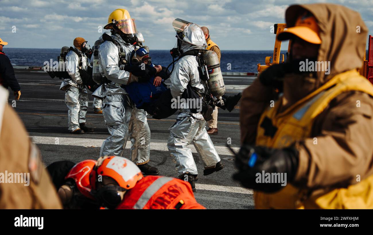 Sailors simulate carrying an injured Sailor during a mass casualty ...