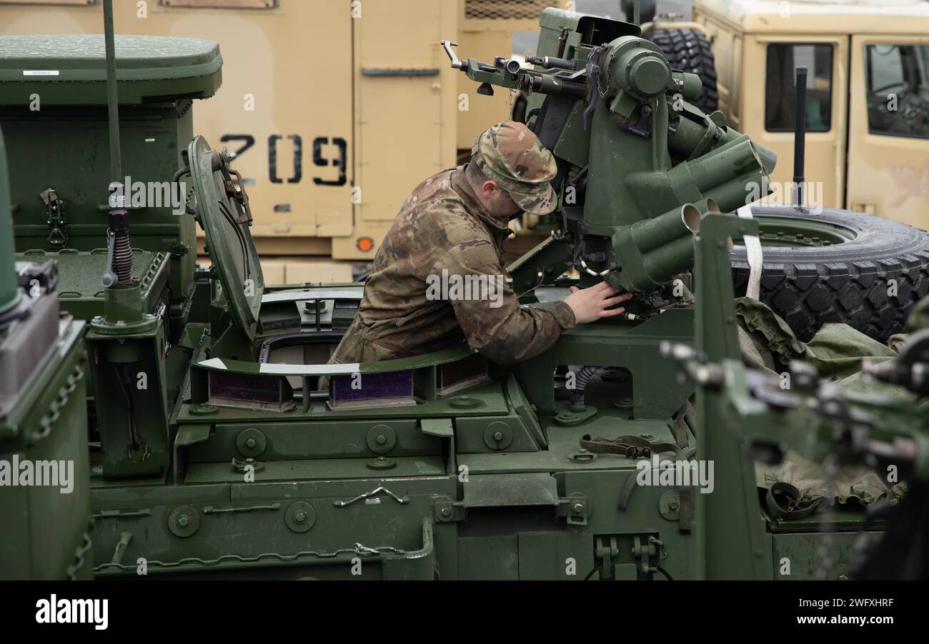 Spc Justin Oosting, 91S Stryker Mechanic assigned to I Corps, conducts daily maintenance on the ...