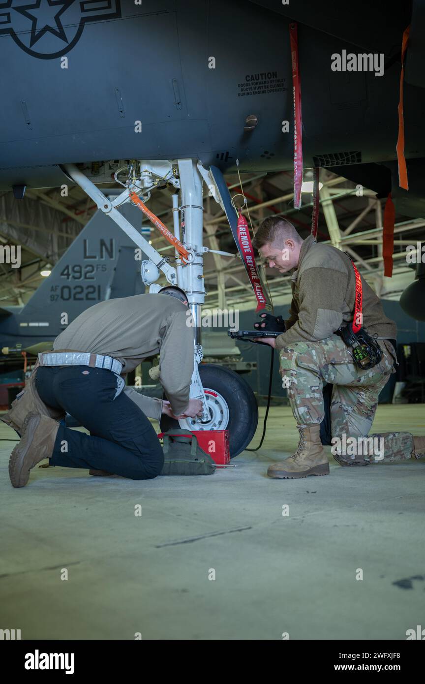 U.S. Air Force Staff Sgt. Daren Burton (right) and Senior Airman Randal ...