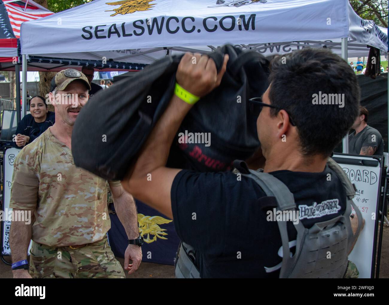 240113-N-LW994-1205 – MIAMI (Jan. 13, 2024) - A Navy SEAL motivates a ...