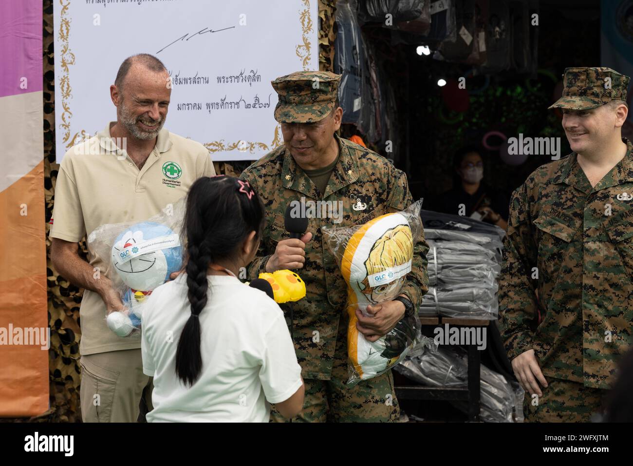 U.S. Marine Corps Maj. Isaac Tibayan, center, the Humanitarian Mine ...