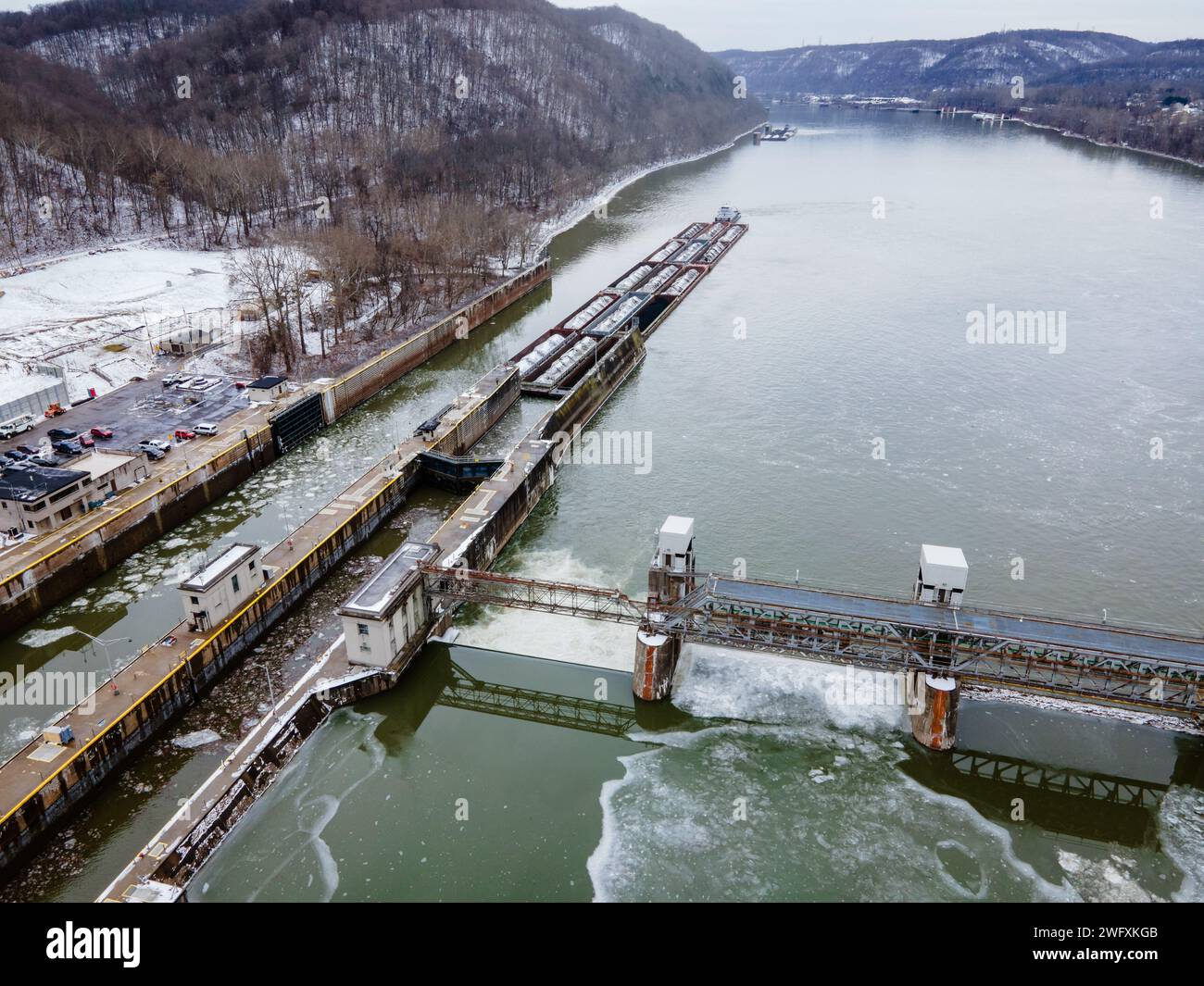 A towboat pushes 15 barges, most filled with coal, on the Ohio River toward the Montgomery Locks ...