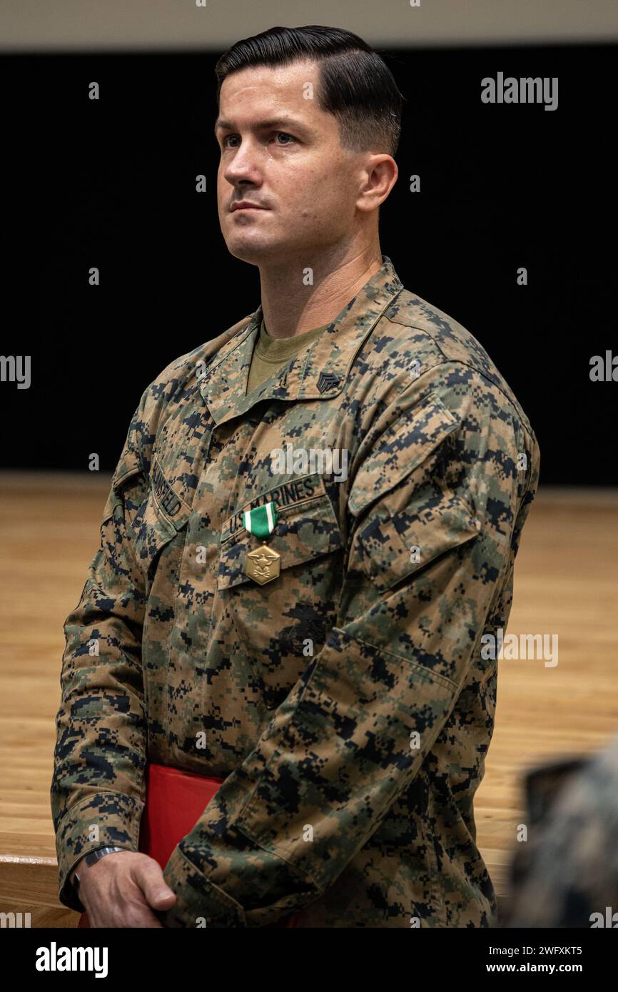 U.S. Marines Corps Sgt. Aidan Blansfield receives a Navy and Marine ...