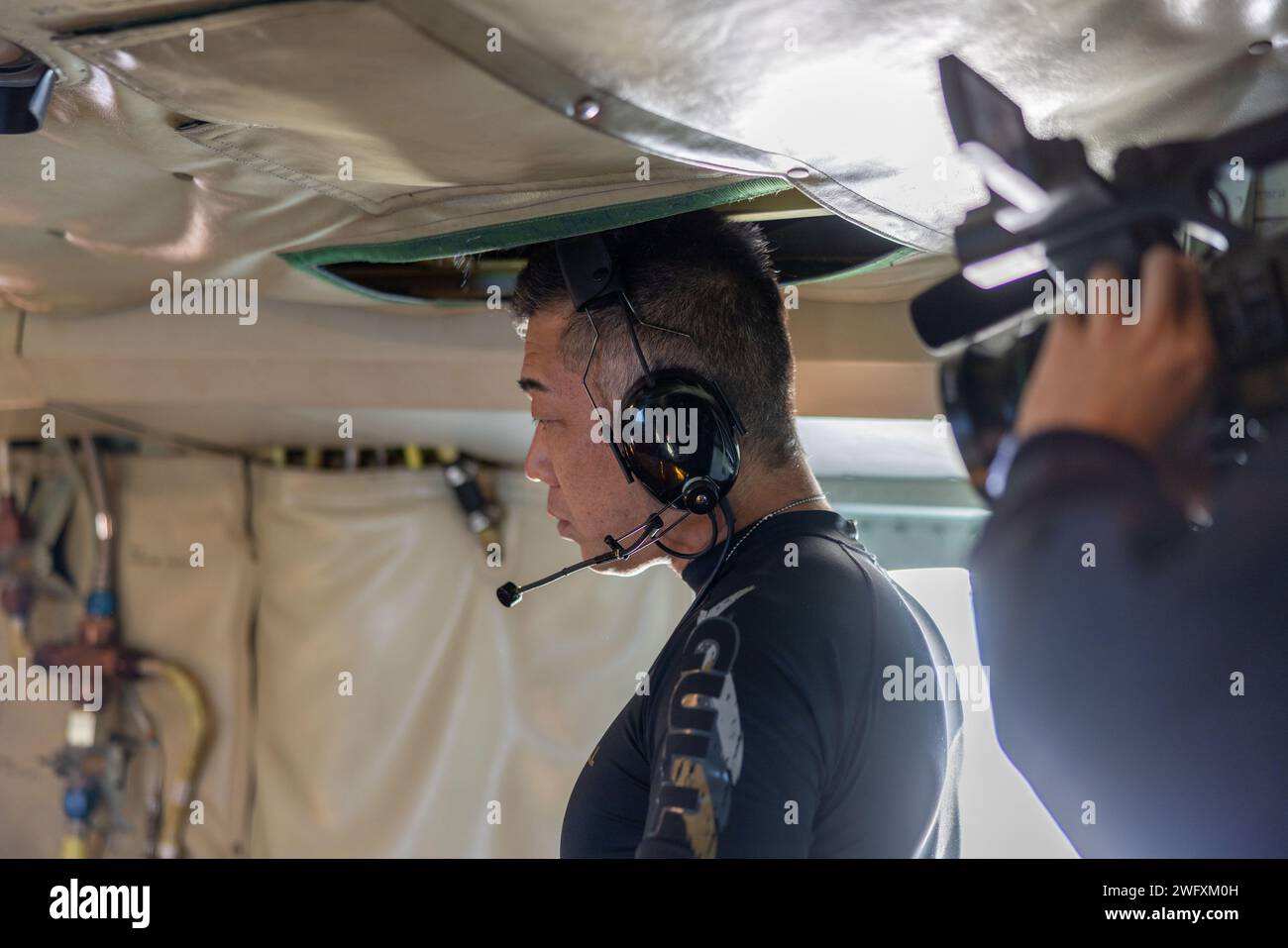 A Japan Maritime Self-Defense Force member with Air Rescue Squadron 71 ...