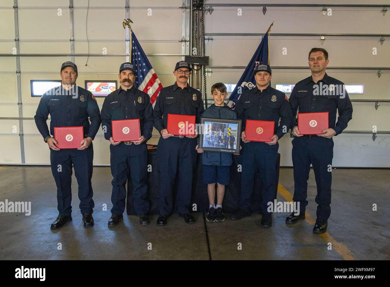 Firefighters with Camp Pendleton Fire and Emergency Services Department, recipients of the ...