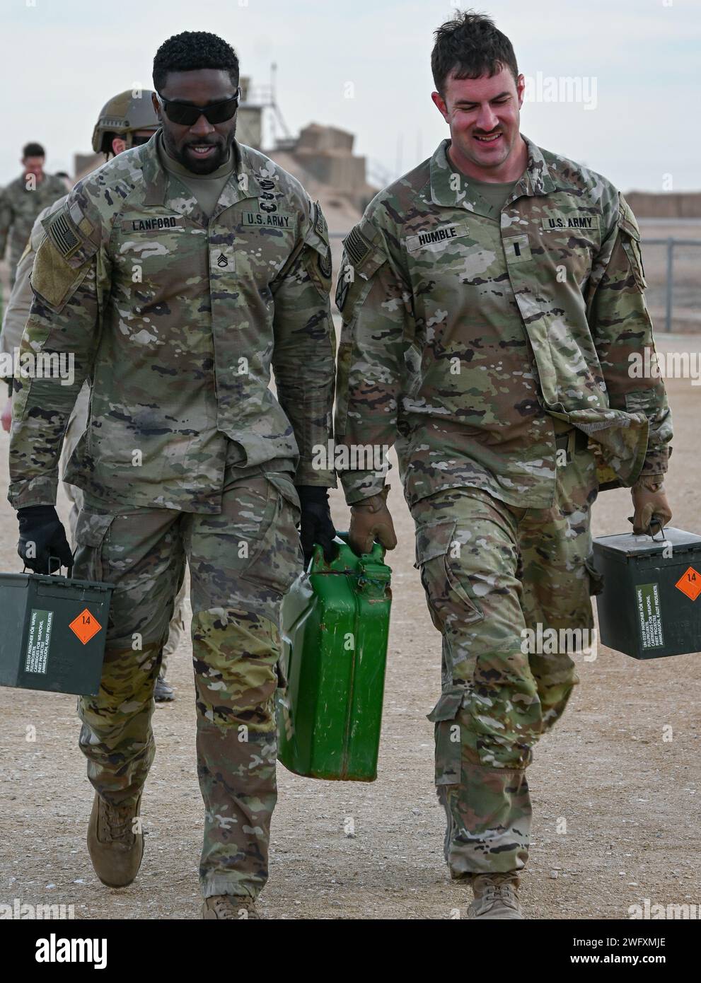 U.S. Army Staff Sgt. Quince Lanford, left, a visual information ...