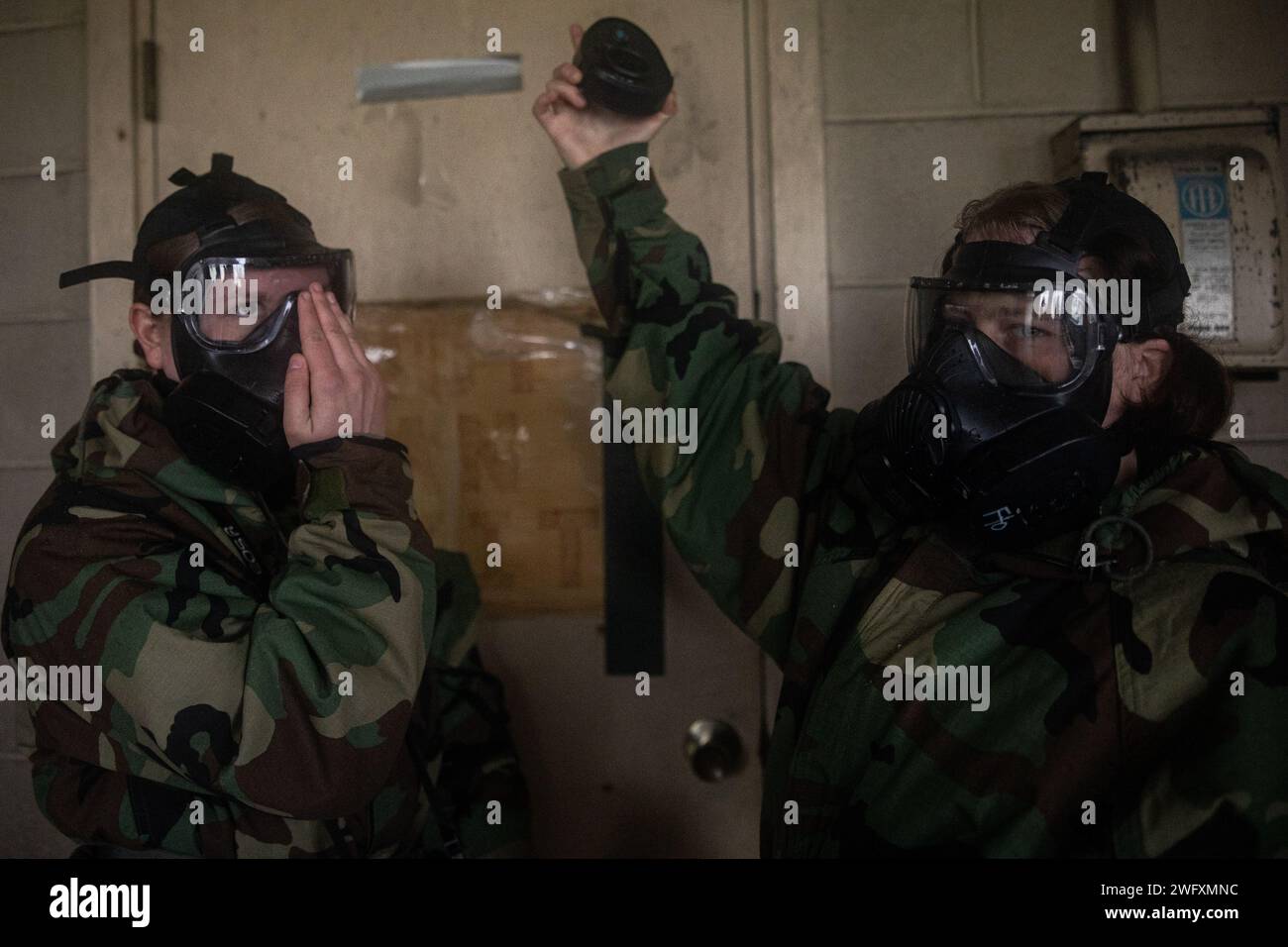 U.S. Marine Corps Cpl. Emily Weiss, left, a combat graphics specialist ...