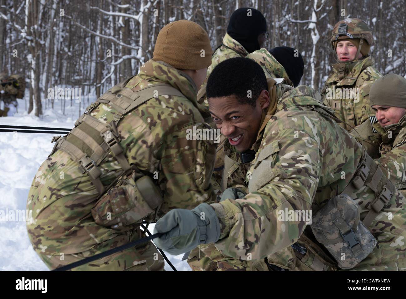 Soldiers from 2nd Brigade Combat Team, 10th Mountain Division hoist ...