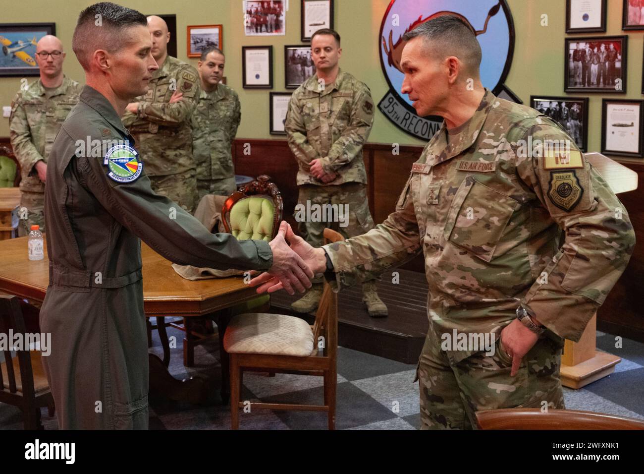 U.S. Air Force Maj. Gen. Thomas Hensley, right, 16th Air Force deputy commander, coins Maj. Clay ...