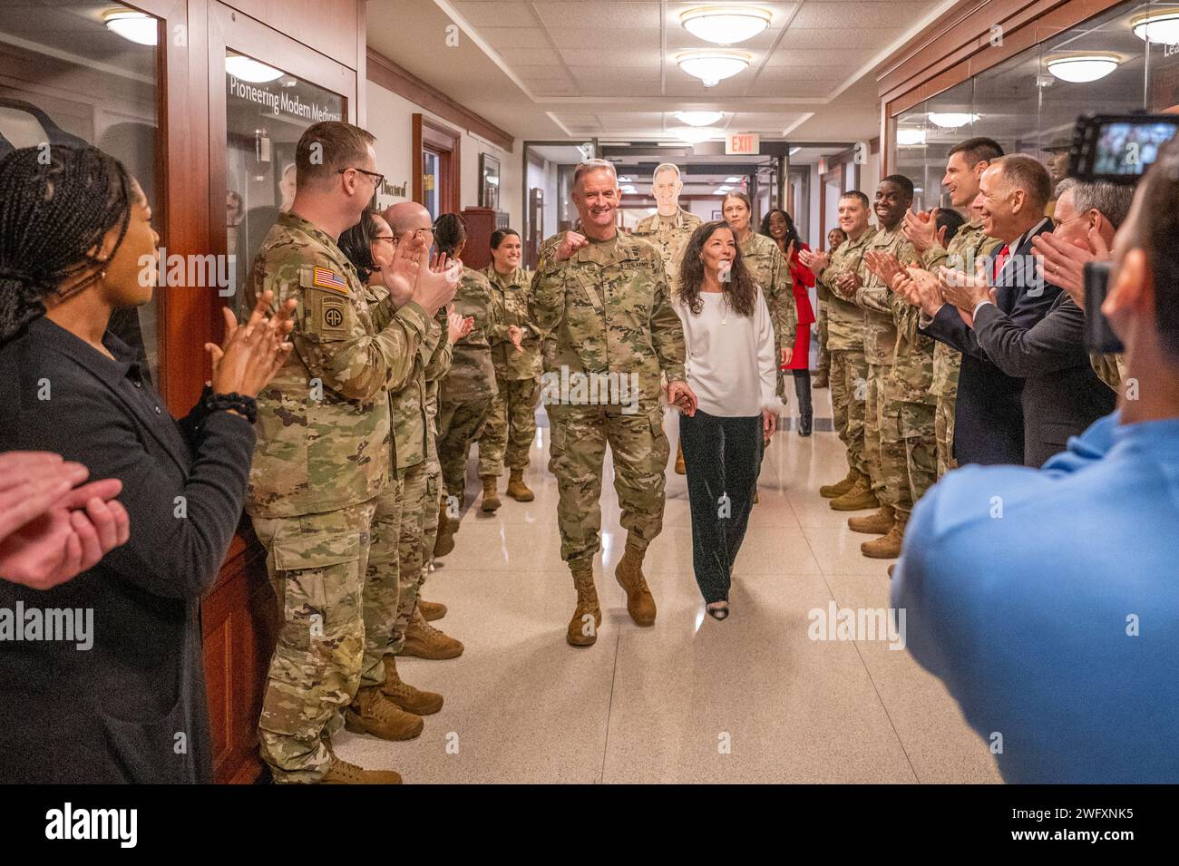 U.S. Soldiers and senior leaders applaud as U.S. Army Lt. Gen. Walter E ...
