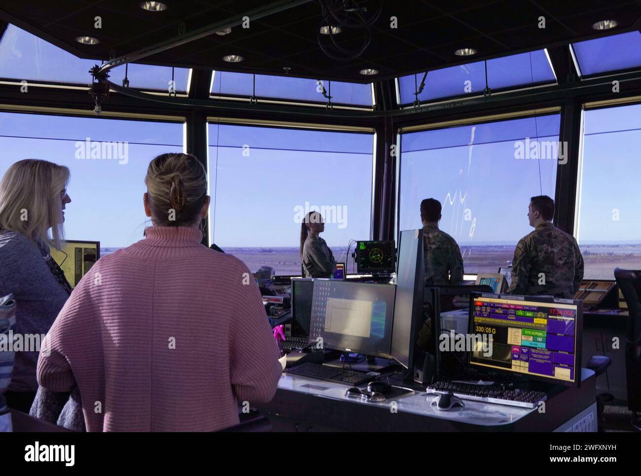 U.S. Air Force 9th Operations Support Squadron members look out from ...