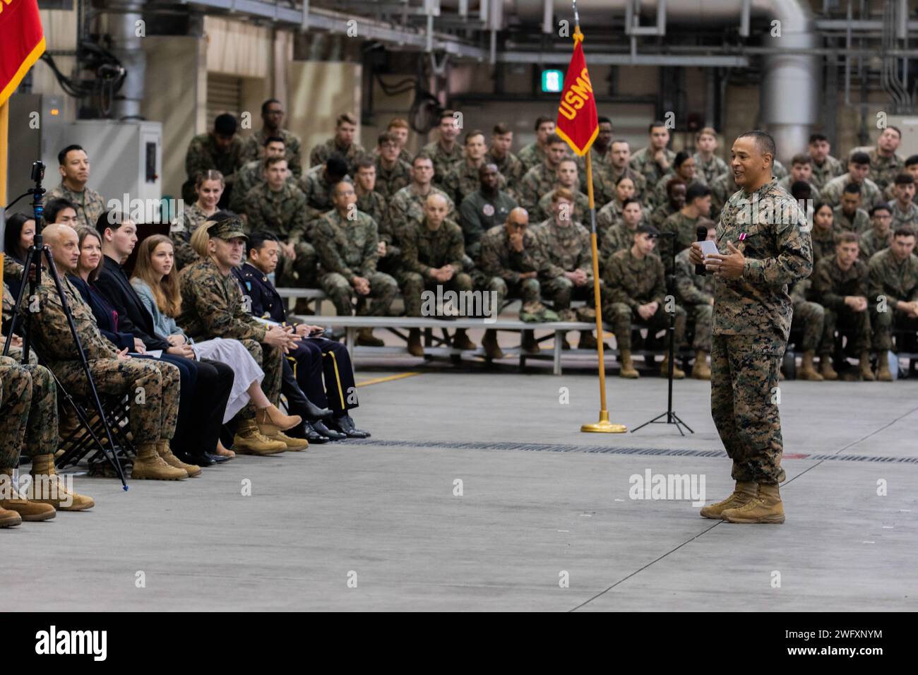 U.S. Marine Corps Lt. Col. Robert Stevenson III, right, gives a speech ...