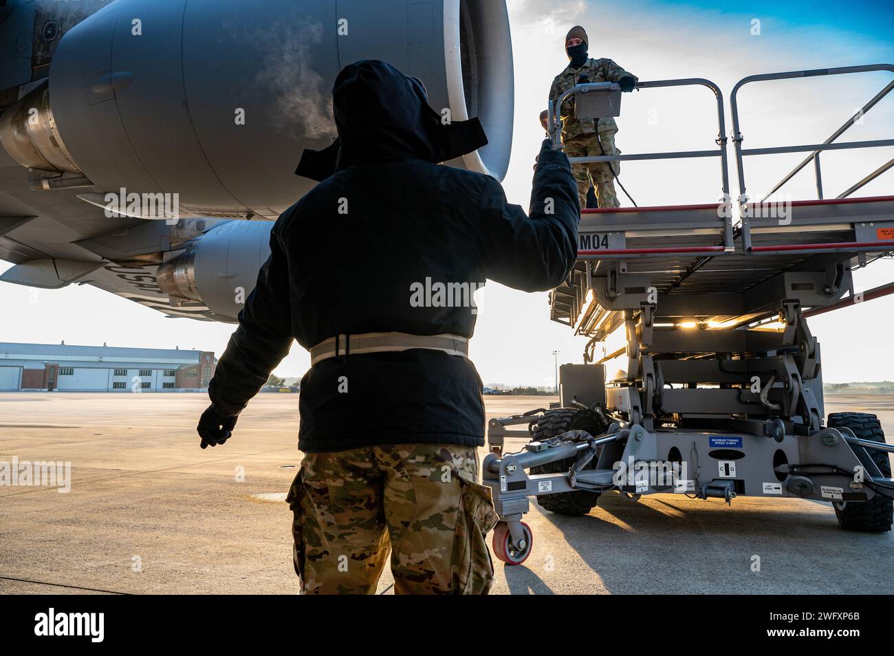Senior Airman Najani Palomino guides fellow 911th Aircraft Maintenance ...