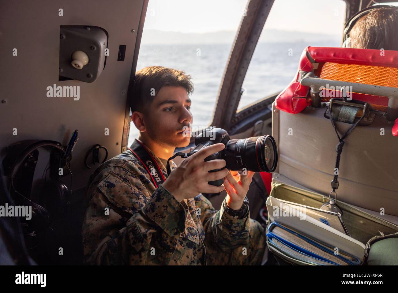 U.S. Marine Corps Lance Cpl. Colin Thibault, a combat videographer with ...